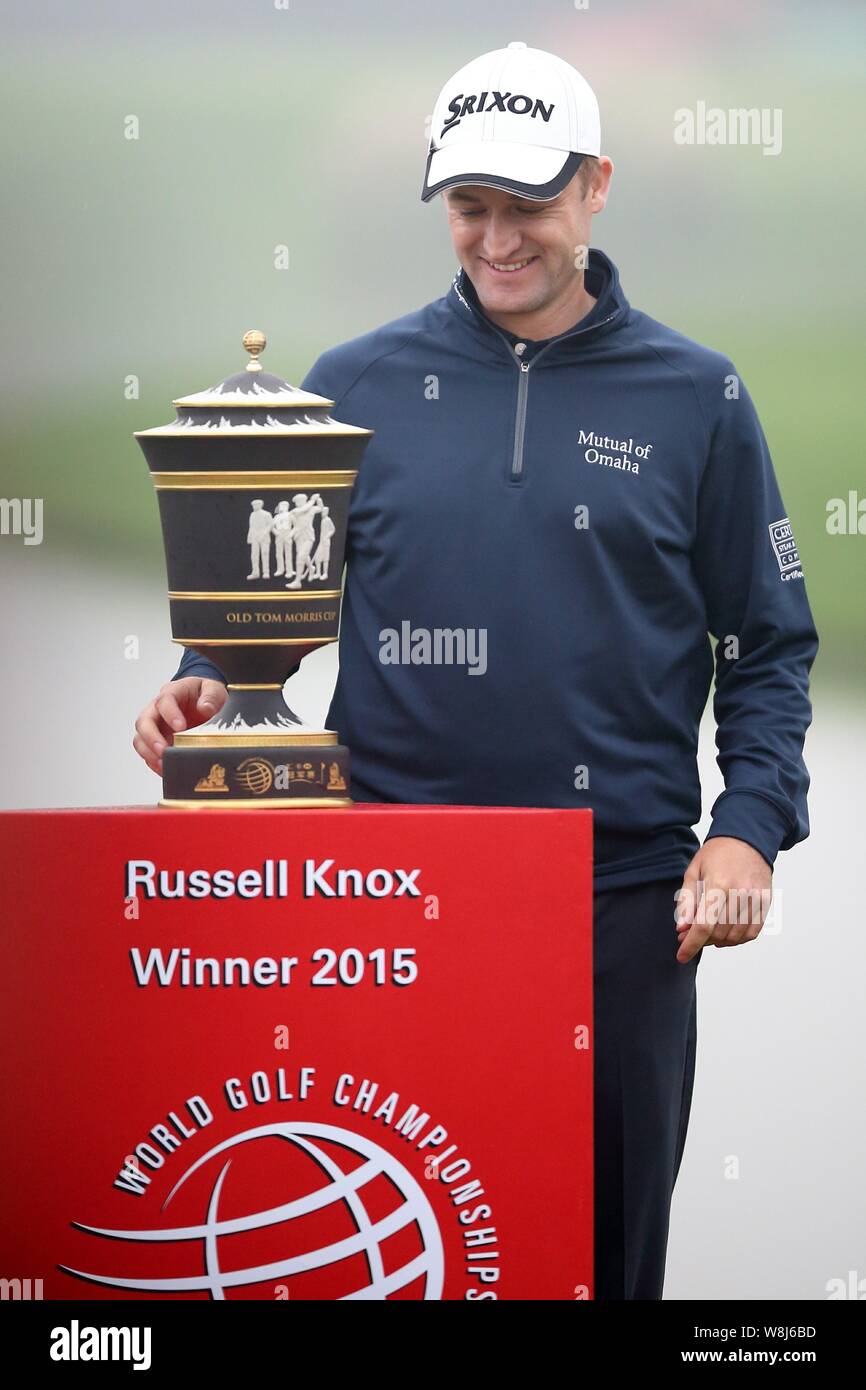 Scottish golfer Russell Knox poses with his champion trophy after ...