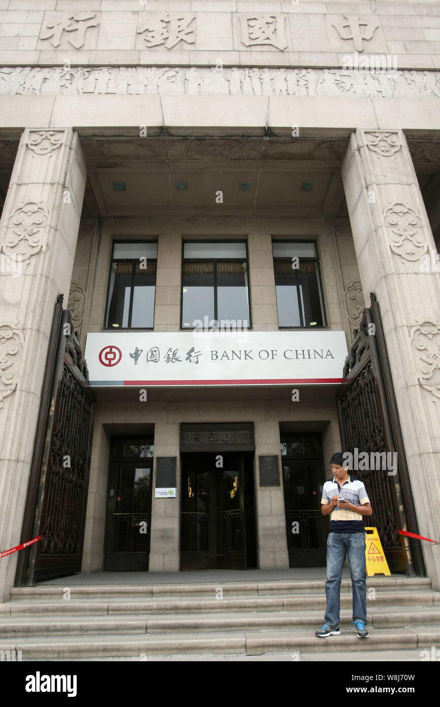 --FILE--A pedestrian stands in front of a branch of Bank of China (BOC ...
