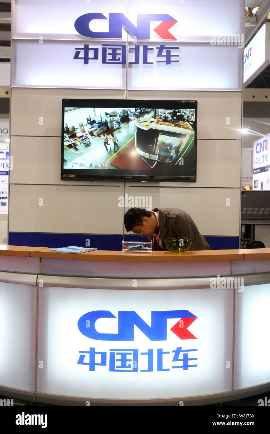 --FILE--A Chinese employee is seen at the stand of CNR (China Northern ...