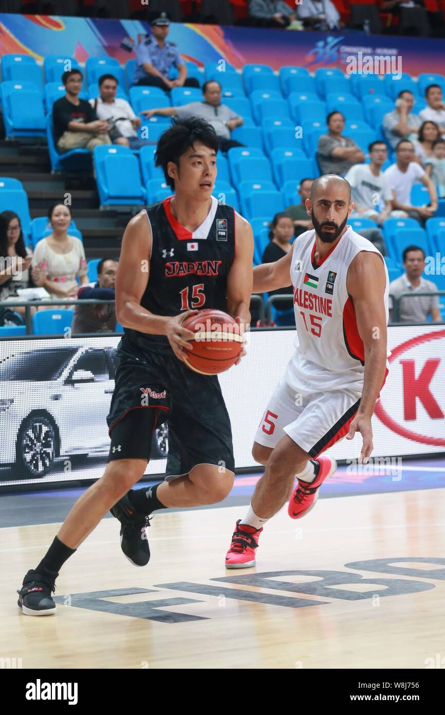 Salim Sakakini of Palestine, right, challenges Joji Takeuchi of Japan ...