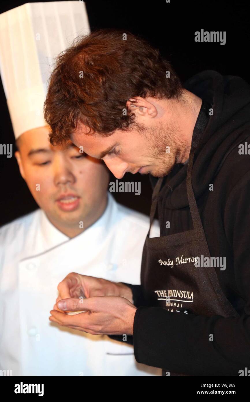 British tennis player Andy Murray, right, learns making dumplings from ...