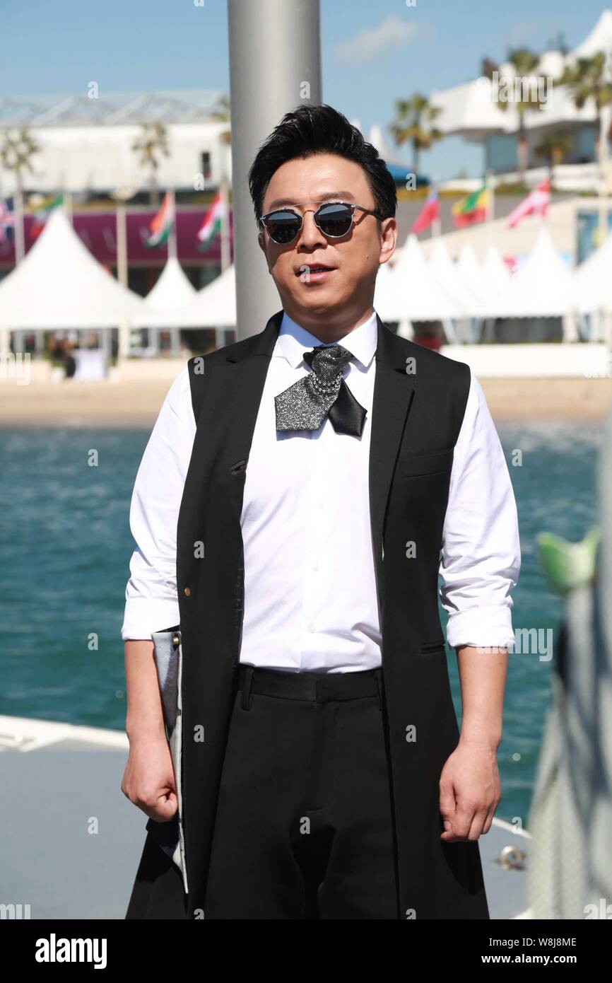 Chinese actor Huang Bo poses at a photocall for his movie "The Ghouls ...