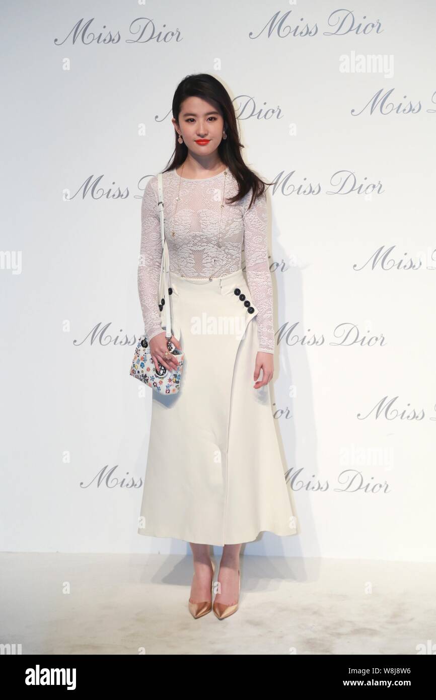 Chinese actress Liu Yifei poses as she arrives for an opening event for ...