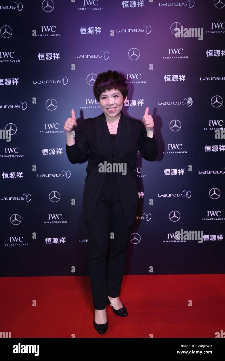 Former Chinese table tennis world champion Deng Yaping poses on the red ...