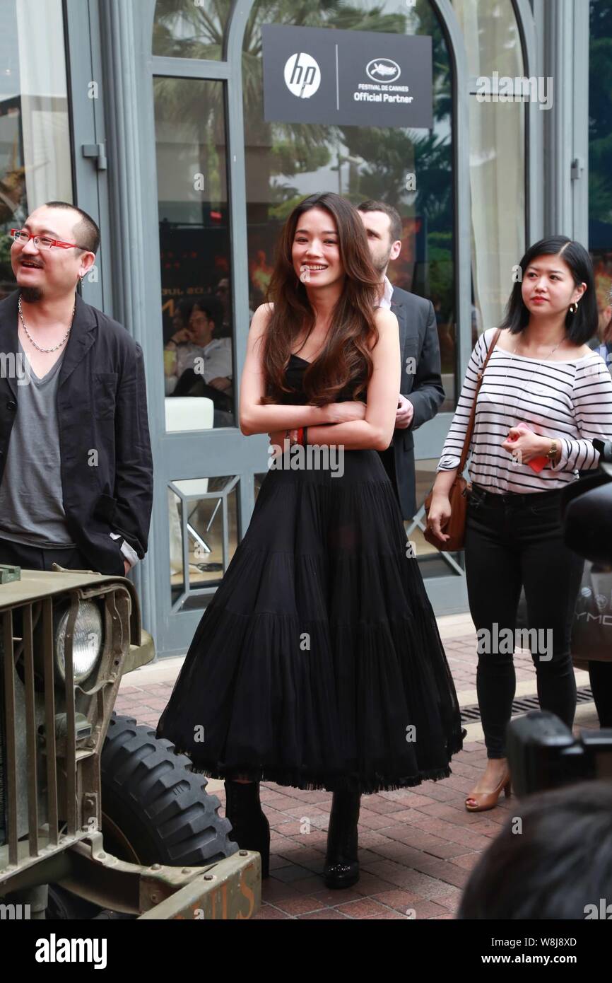 Taiwanese actress Shu Qi, center, smiles at a photocall for her movie ...