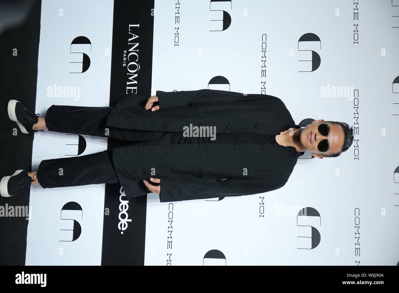 Chinese actor Deng Chao poses during the Comme Moi fashion show by ...