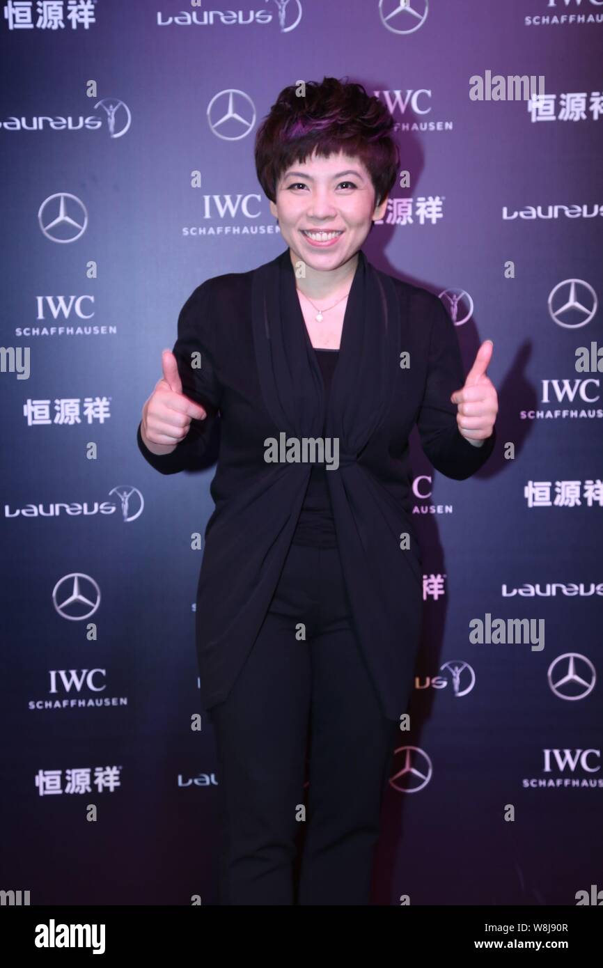 Former Chinese table tennis world champion Deng Yaping poses on the red ...