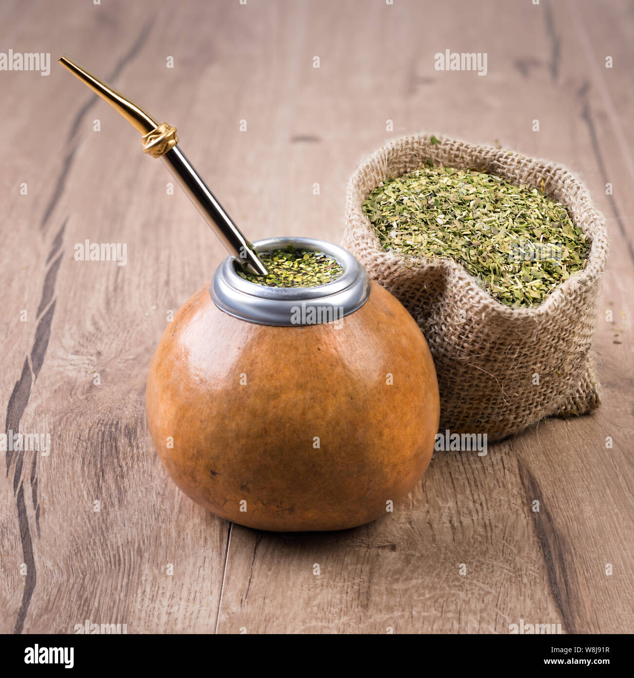 Yerba mate in a traditional calabash gourd and bag of dry herb Stock ...