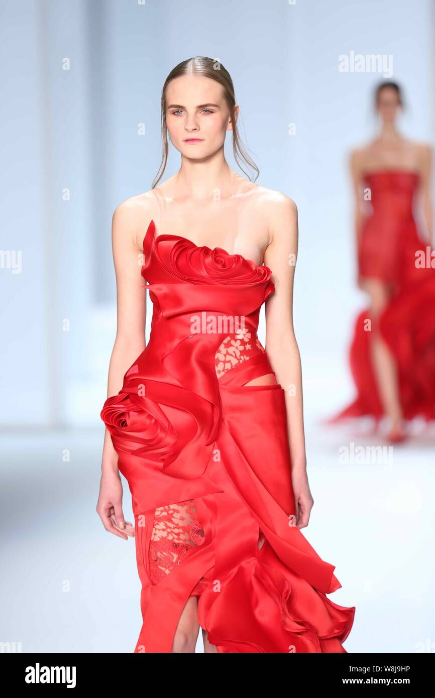 A model displays a new creation at the Lan Yu fashion show during the ...