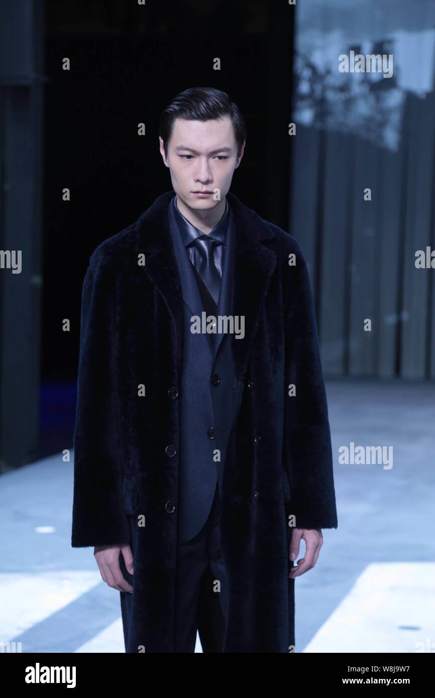 Chinese model Lv Piqiang displays a new creation at the Hogan 2015 Fall ...