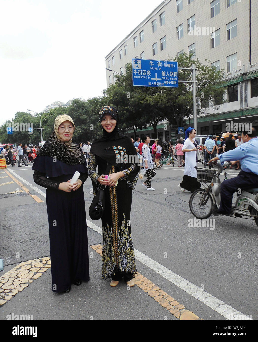 Chinese women of Hui ethnic minority wearing burqa attend a celebration ...