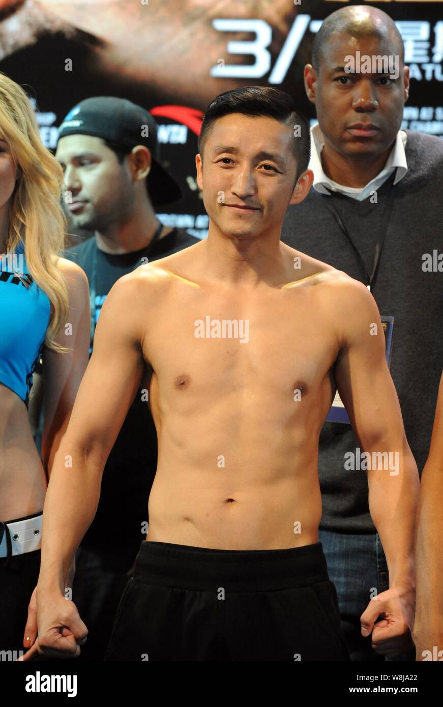 Olympic boxing gold medalist Zou Shiming of China, front, poses during ...