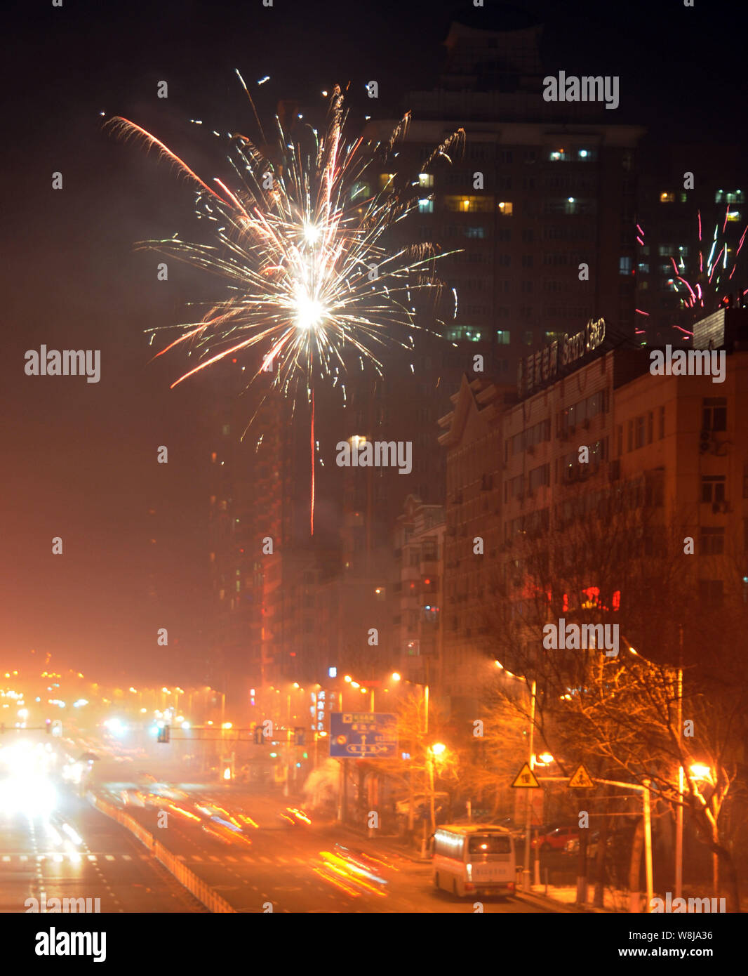 Fireworks explode over a residential area for Spring Festival to ...