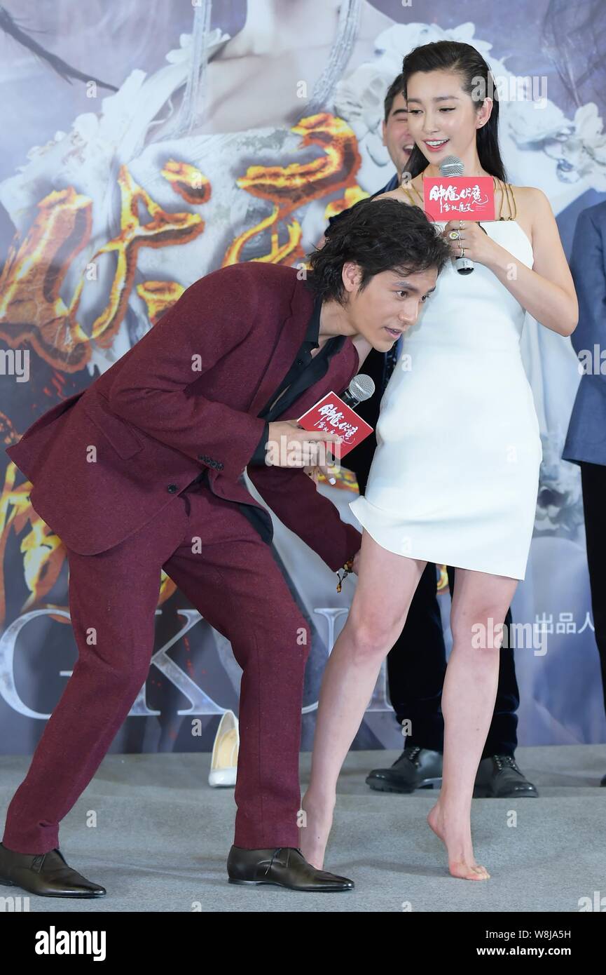 Chinese actor Chen Kun, left, tries to hold up actress Li Bingbing at a ...