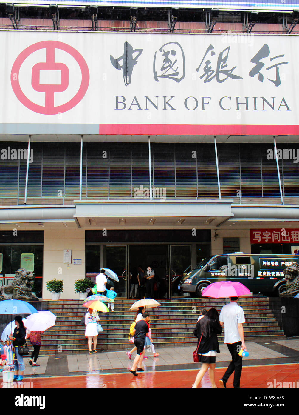 --FILE--Pedestrians walk past a branch of Bank of China (BOC) in ...