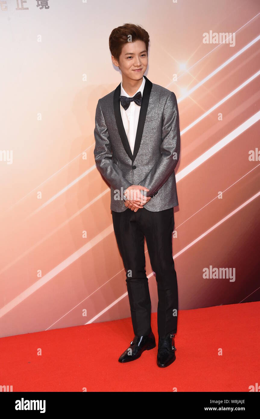 Chinese singer Lu Han poses on the red carpet as he arrives for the ...