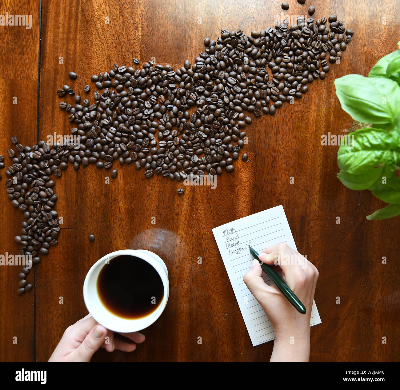 Home made coffee with coffee beans. Woman's hands writing a list Stock ...