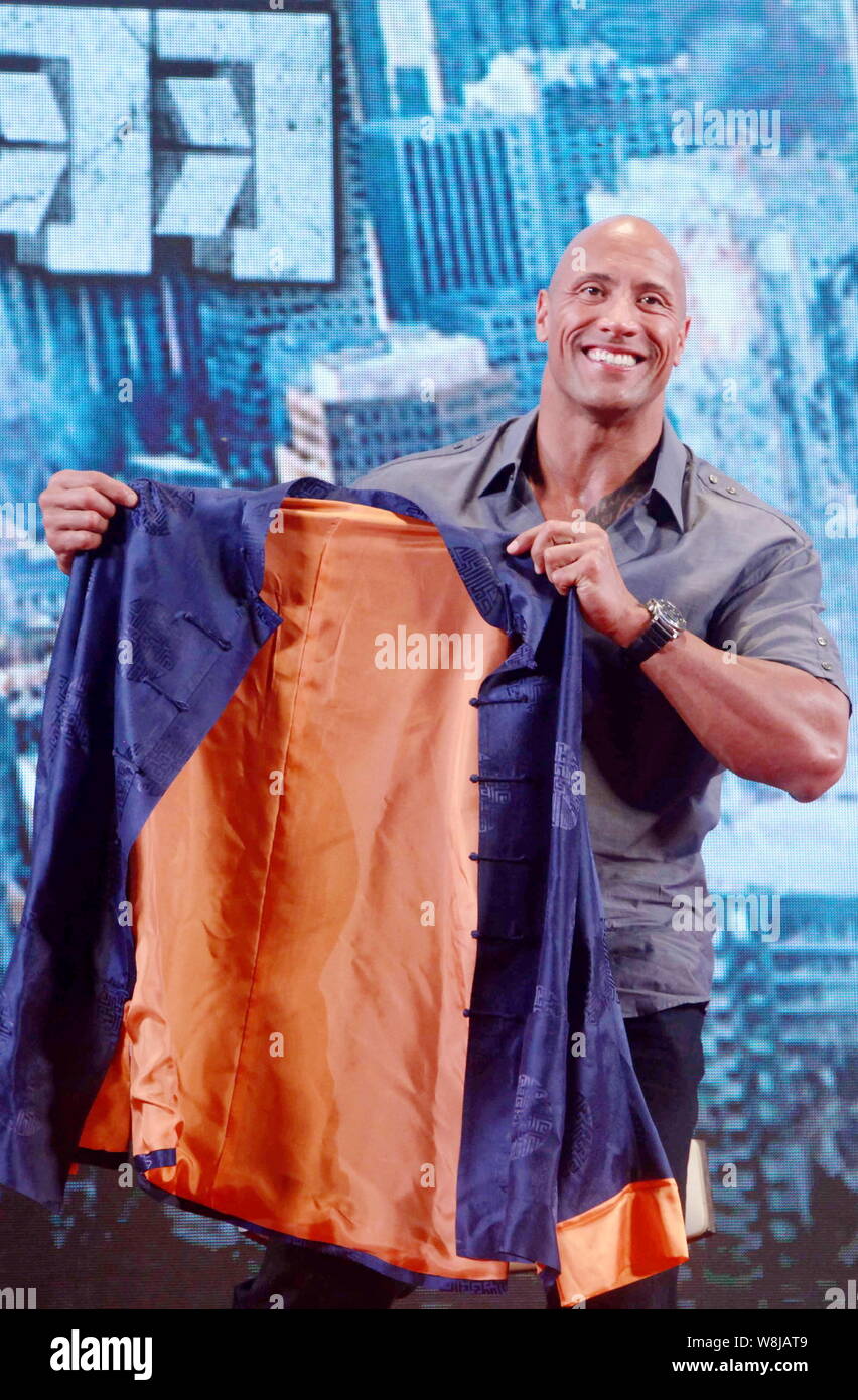 American actor Dwayne Johnson shows a traditional Chinese Tang suit ...