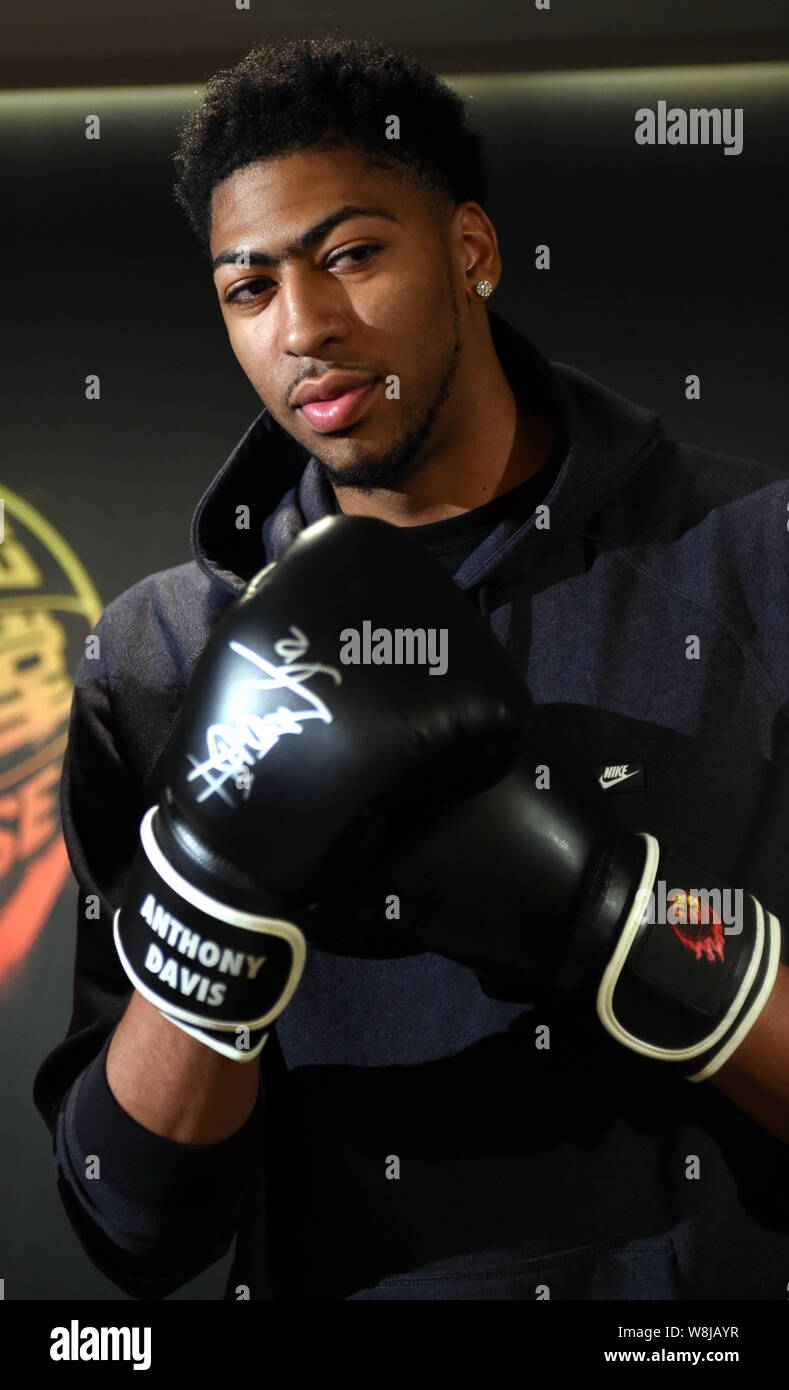 NBA star Anthony Davis wearing boxing gloves poses at a media event in ...