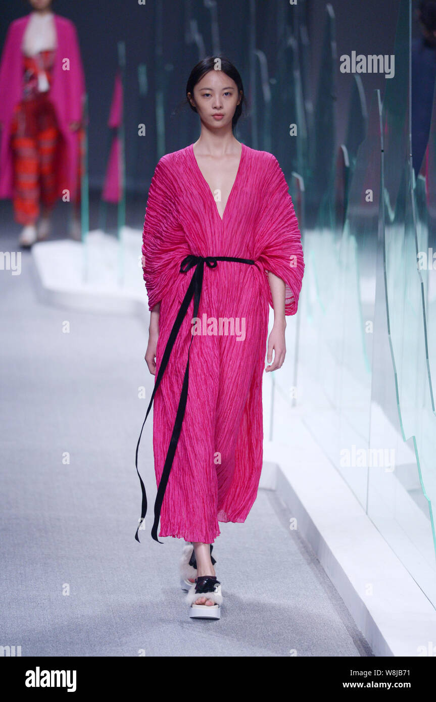 A model displays a new creation by Chinese designer Zhu Chongyun at a ...
