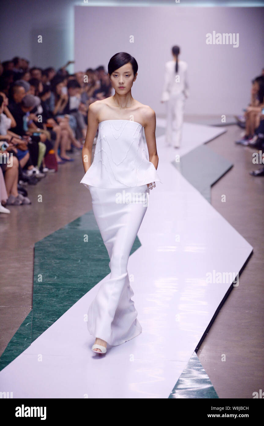 Chinese model Pei Bei displays a new creation at the fashion show for ...