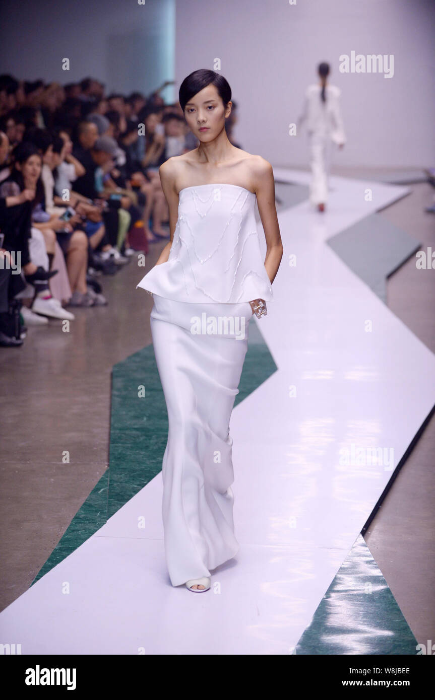 Chinese model Pei Bei displays a new creation at the fashion show for ...