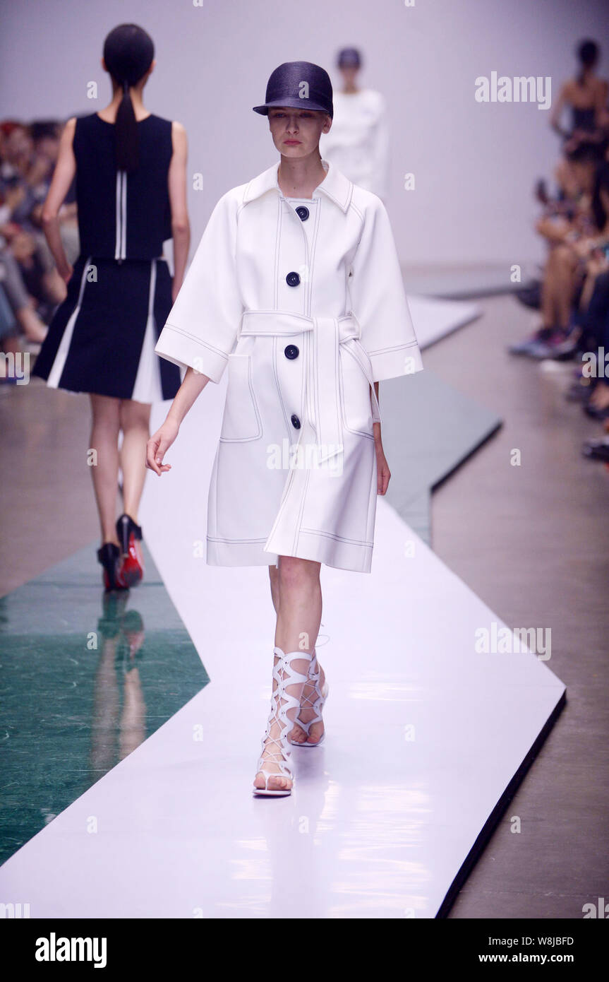 A model displays a new creation at the fashion show for the Spring ...