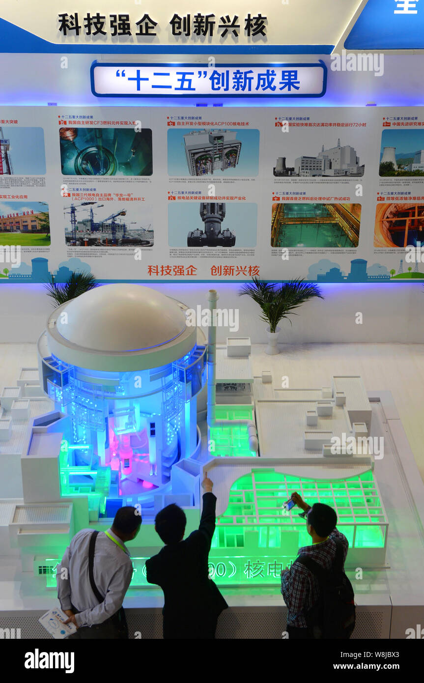 --FILE--Visitors look at a model of the Hualong-1 (ACP1000) nuclear ...