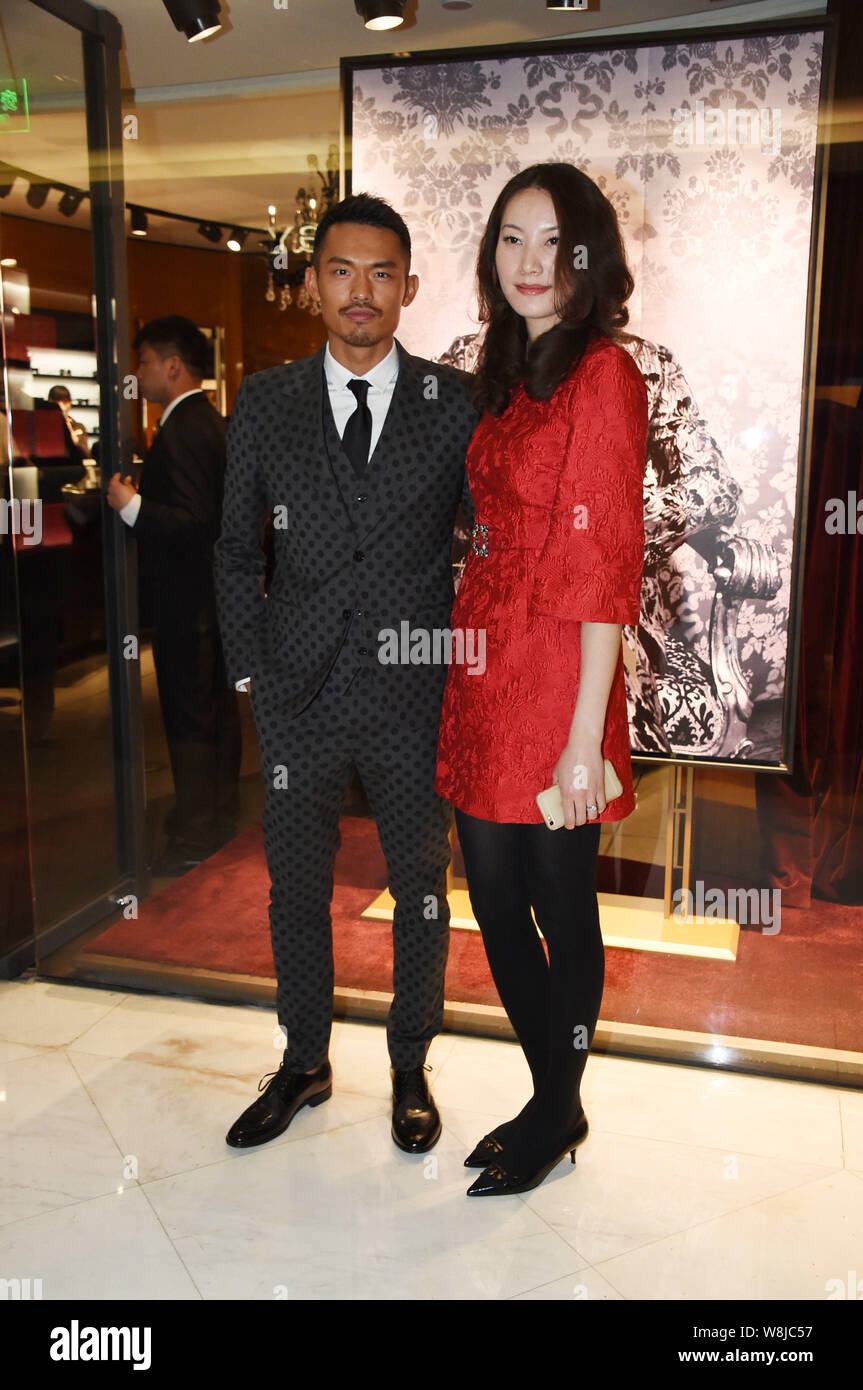 Chinese badminton star Lin Dan, left, and his wife Xie Xingfang pose at ...