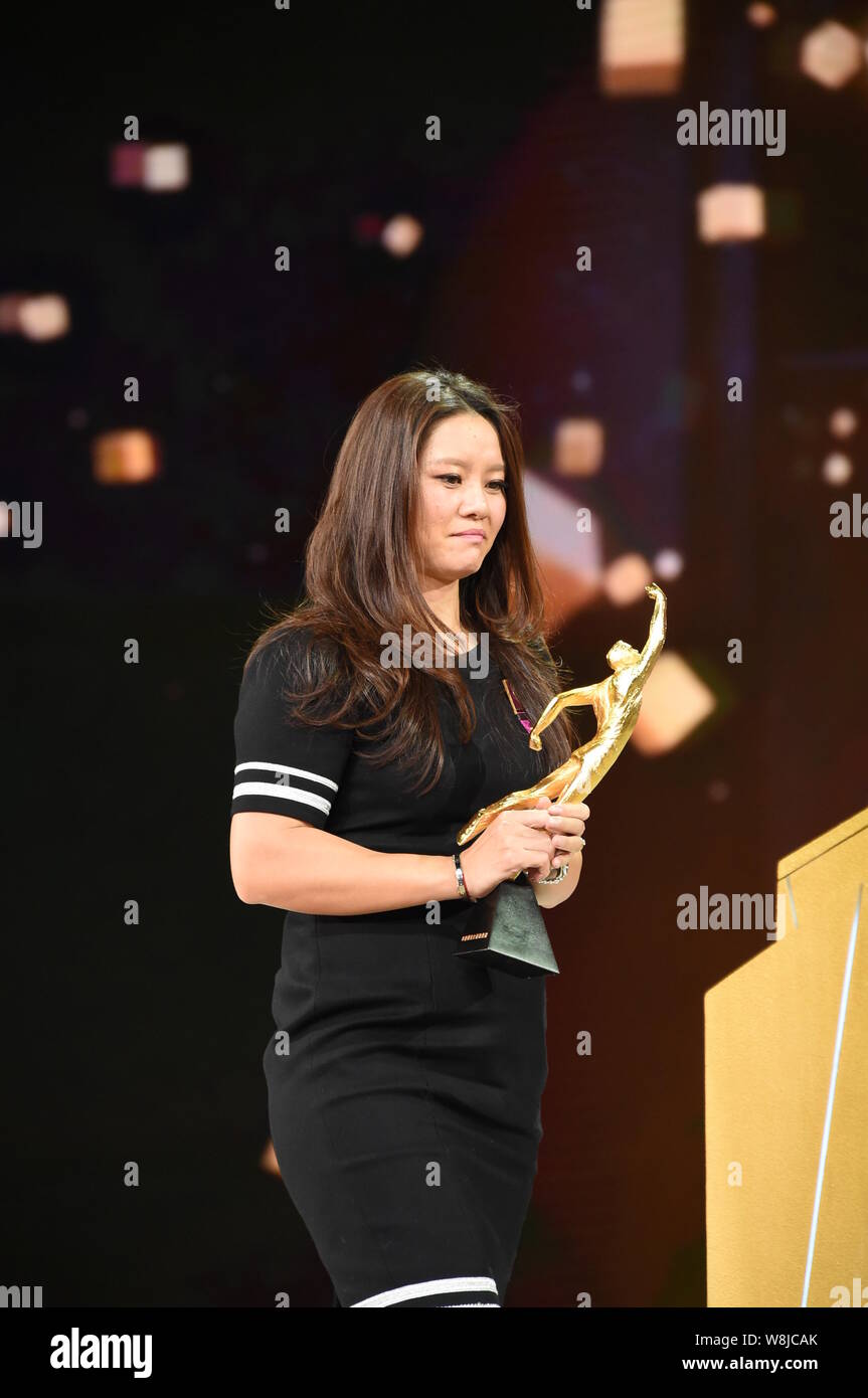 Retired Chinese tennis star Li Na poses with her trophy of the Best ...