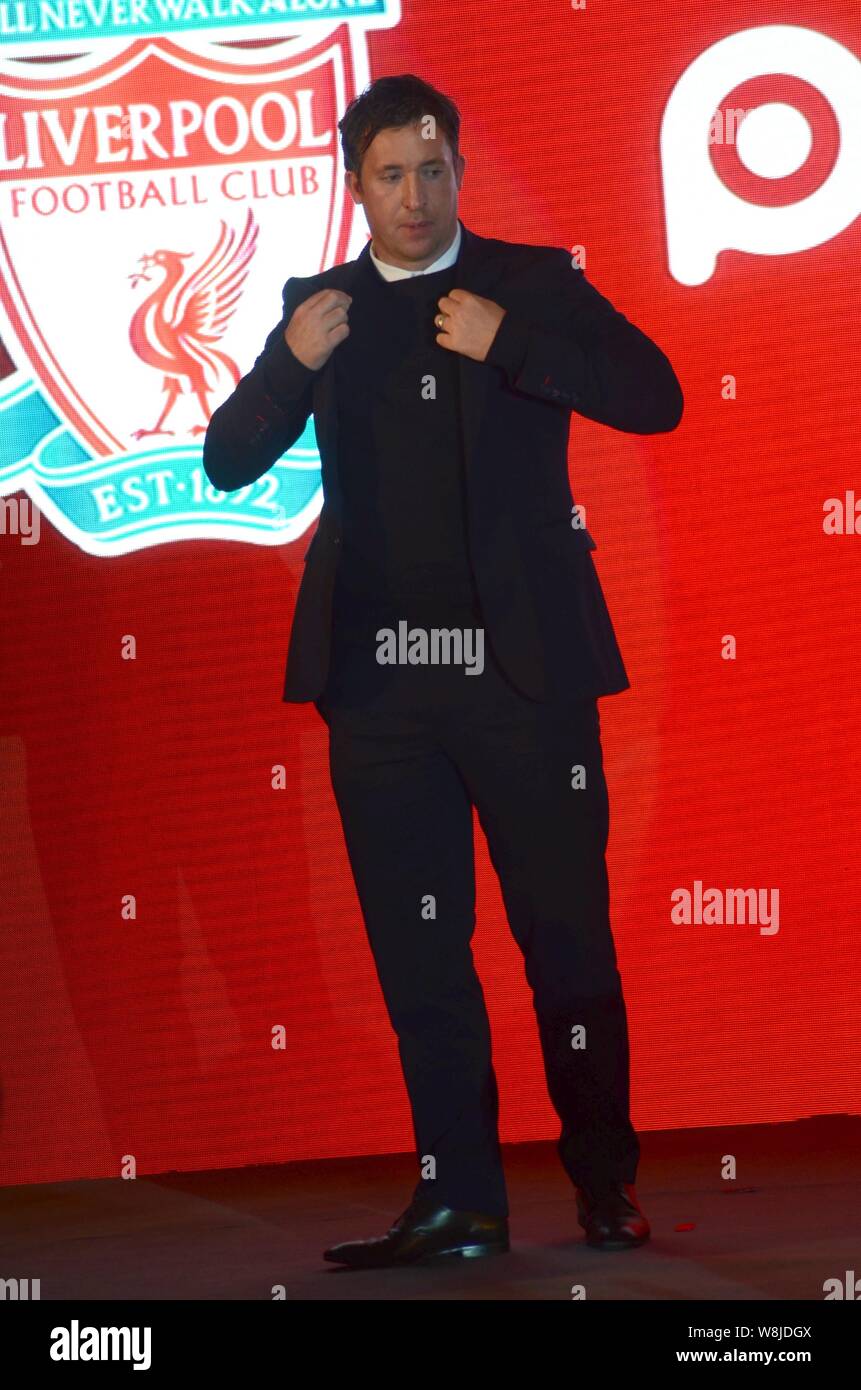 Retired English soccer player Robbie Fowler poses at a fan meeting ...