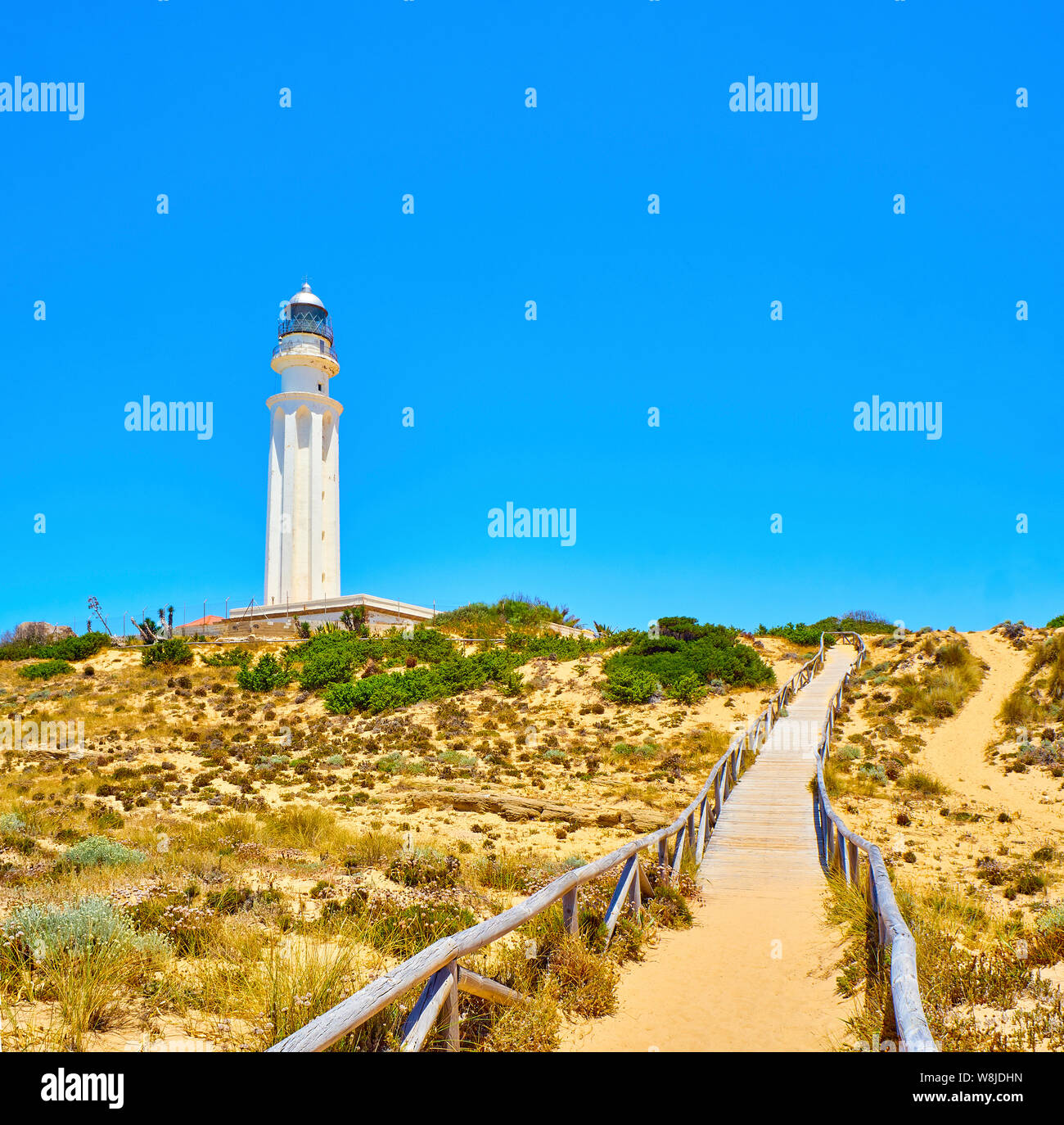 Wooden walkway going to Faro de Trafalgar Lighthouse, in The Cabo de ...