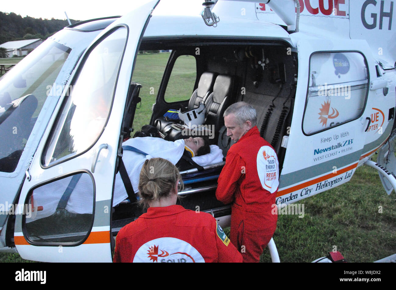 Rescue helicopter personnel prepare a patient for hospital, Westland ...