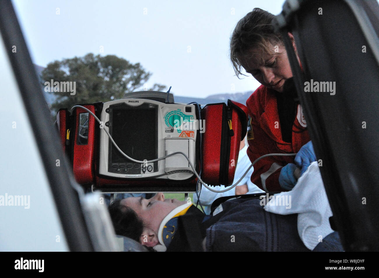 Rescue helicopter personnel prepare a patient for hospital, Westland ...