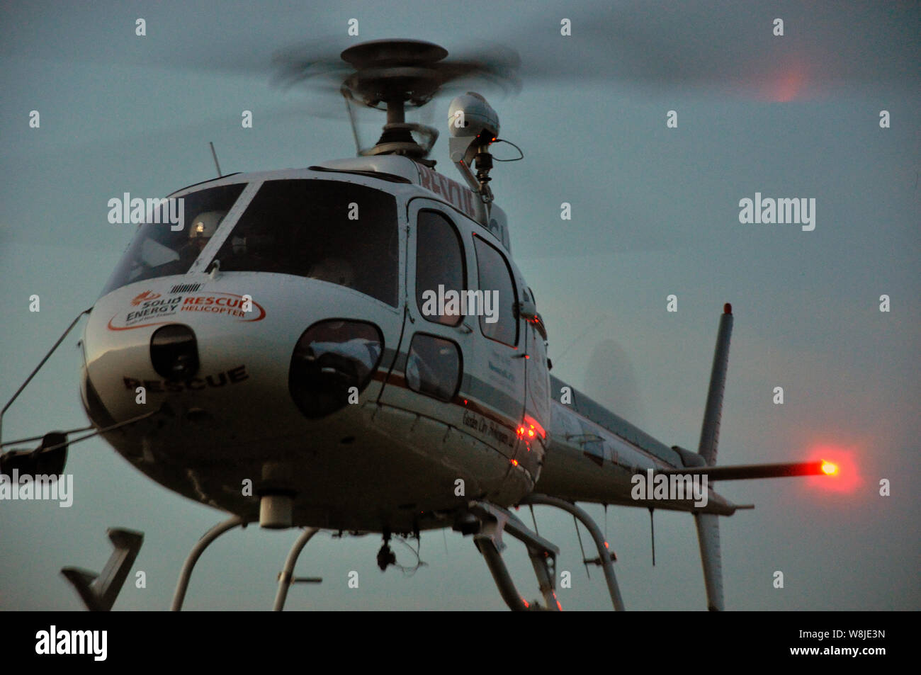 Rescue chopper arrives in evening light, Westland, New Zealand Stock ...