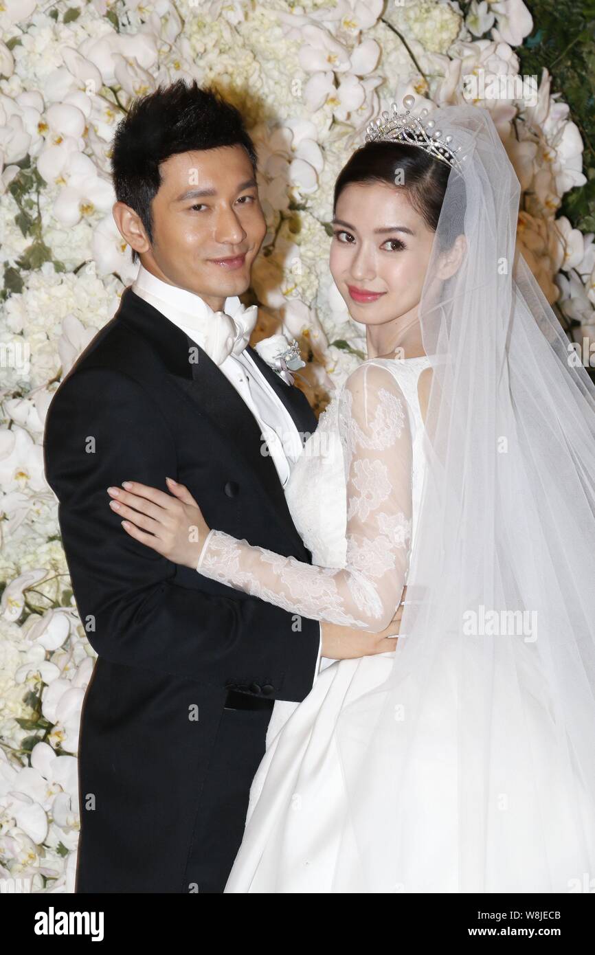 Chinese actor Huang Xiaoming, left, and his actress wife Angelababy ...