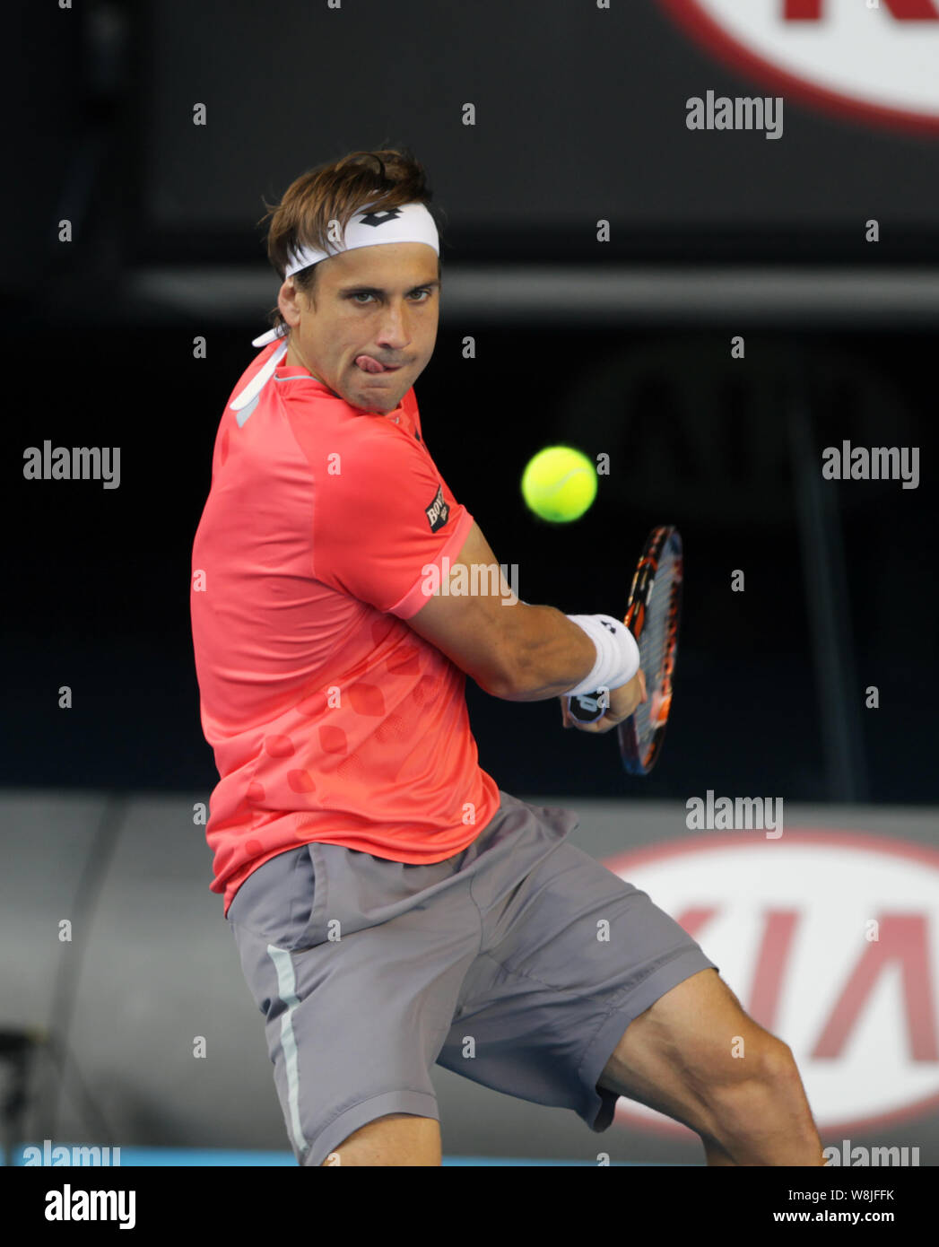 David Ferrer of Spain returns a shot to Kei Nishikori of Japan in their men's singles fourth ...