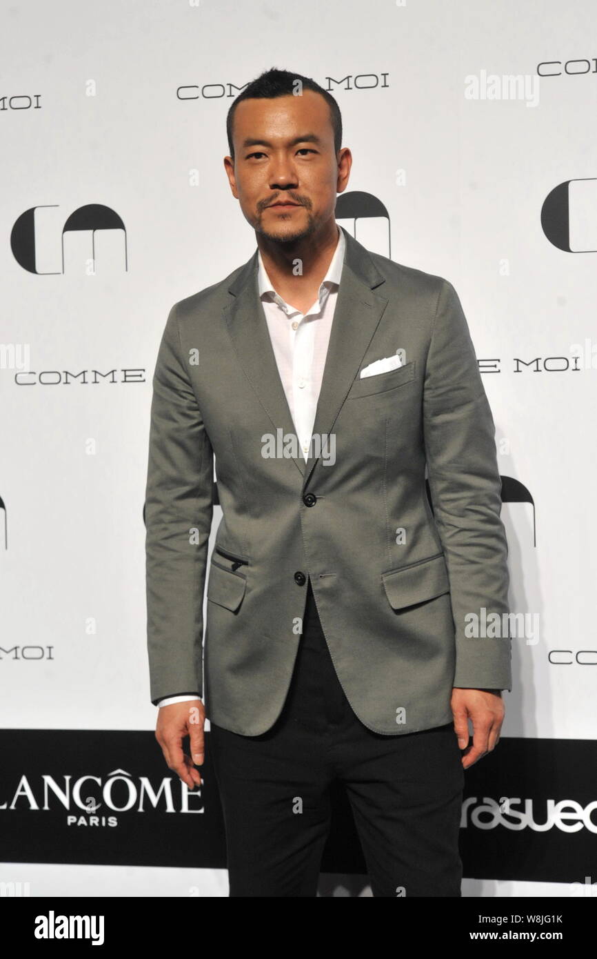 Chinese actor Liao Fan poses during the Comme Moi fashion show by ...
