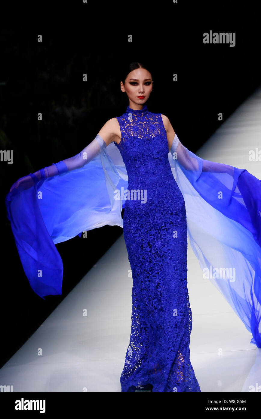 A model displays a new creation by Chinese fashion designer Mary Ma in ...