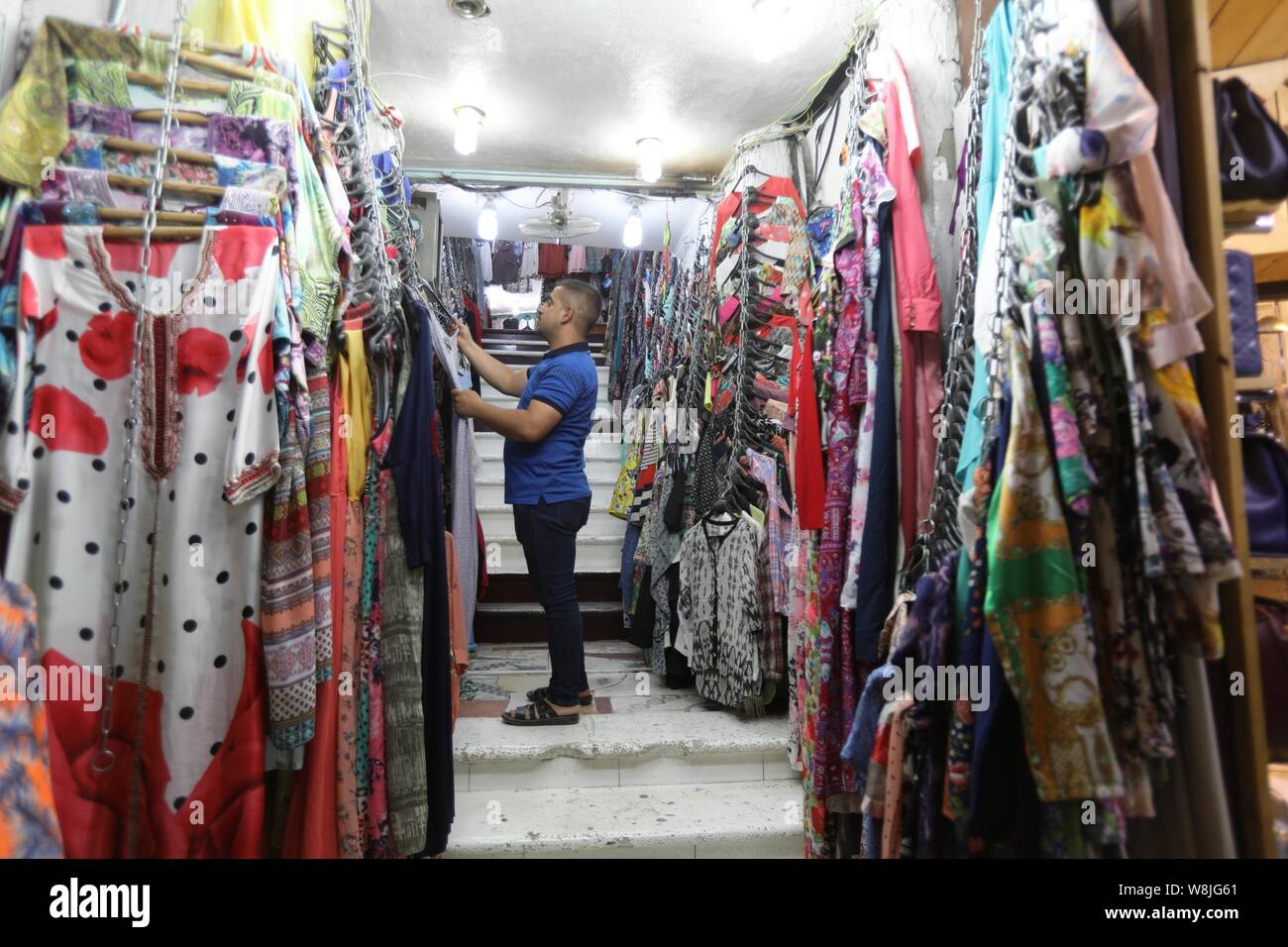 Baghdad, Iraq. 9th Aug, 2019. Iraqi people shop clothes in preparation ...