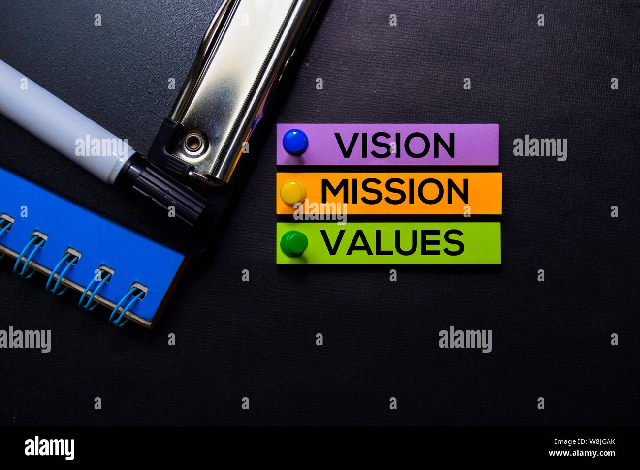 Vision, Mission, Values text on sticky notes isolated on Black desk ...