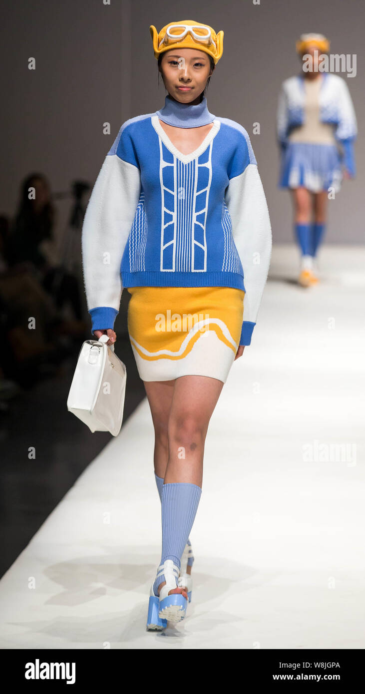 A model displays a new creation during a fashion show released by ...