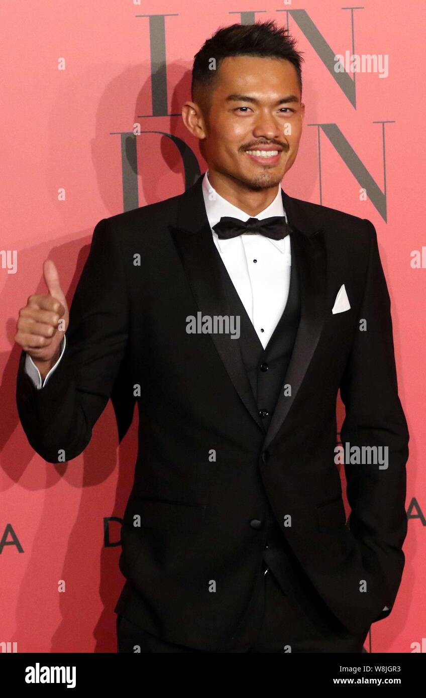 Chinese badminton star Lin Dan poses during the Dolce & Gabbana ...