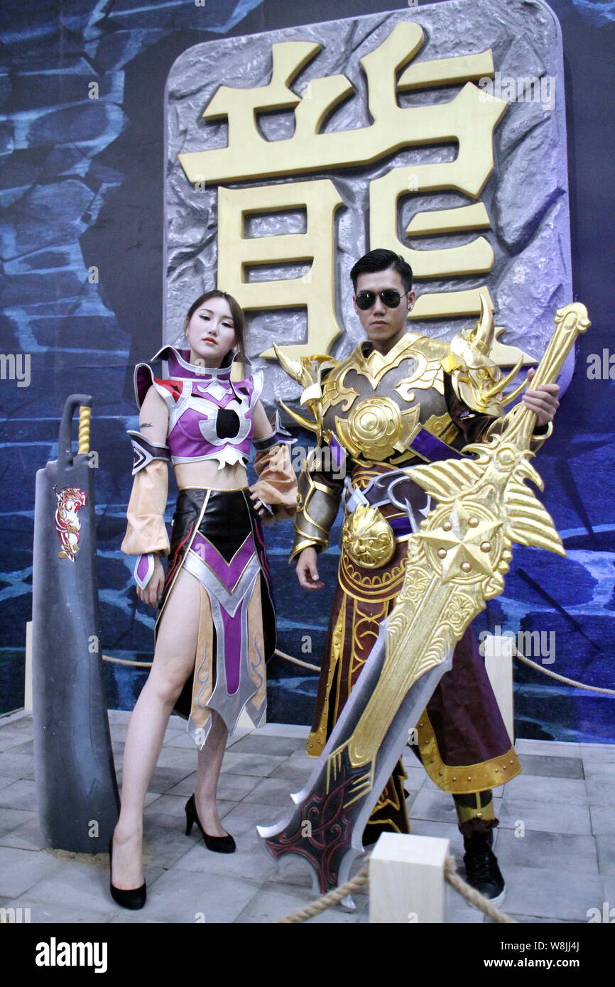 Entertainers dressed in cosplay costumes pose during the 13th China ...