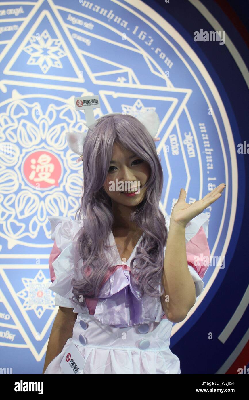 A showgirl dressed in a cosplay costume poses during the 11th China ...