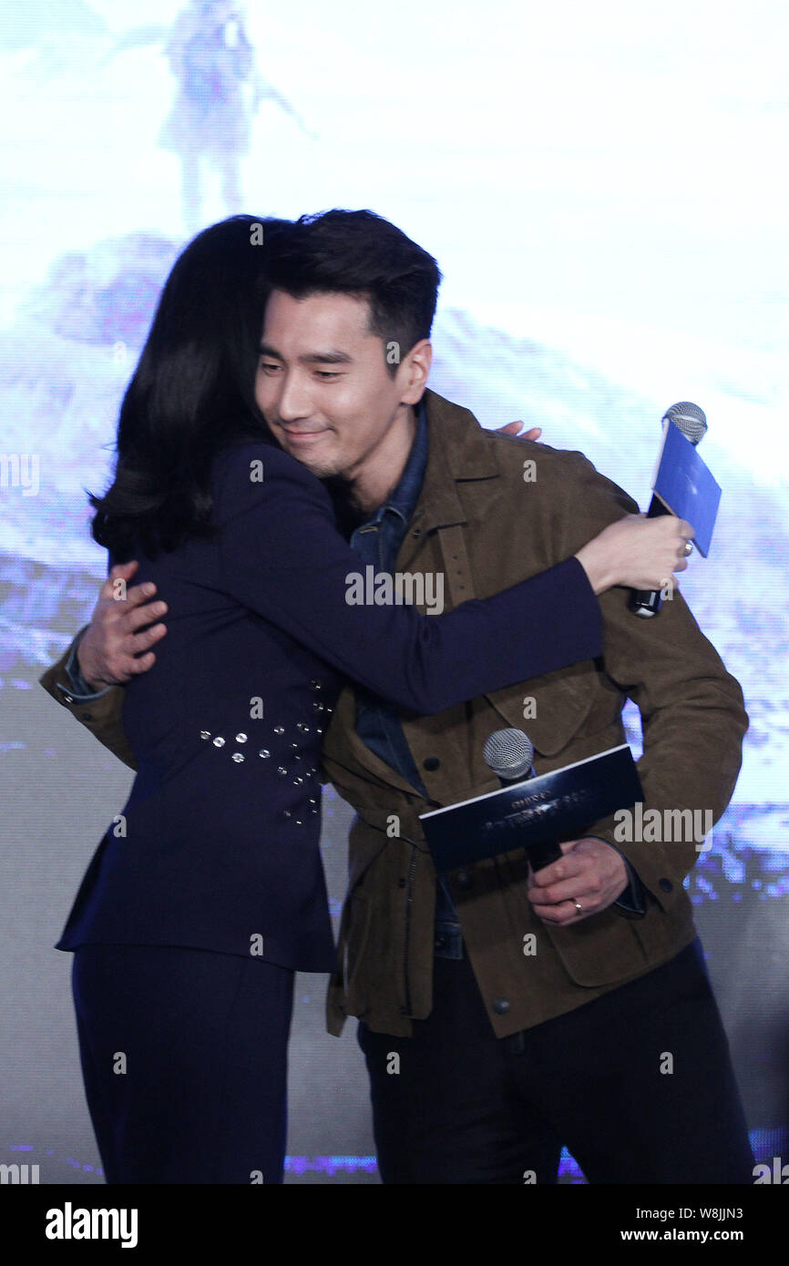 Chinese actress Yao Chen, left, hugs Taiwanese actor Mark Zhao during a ...
