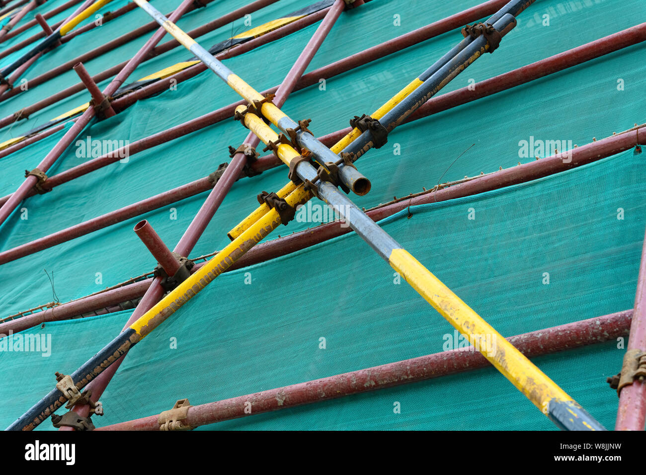 scaffolding and protection netting on an unfinished building Stock ...