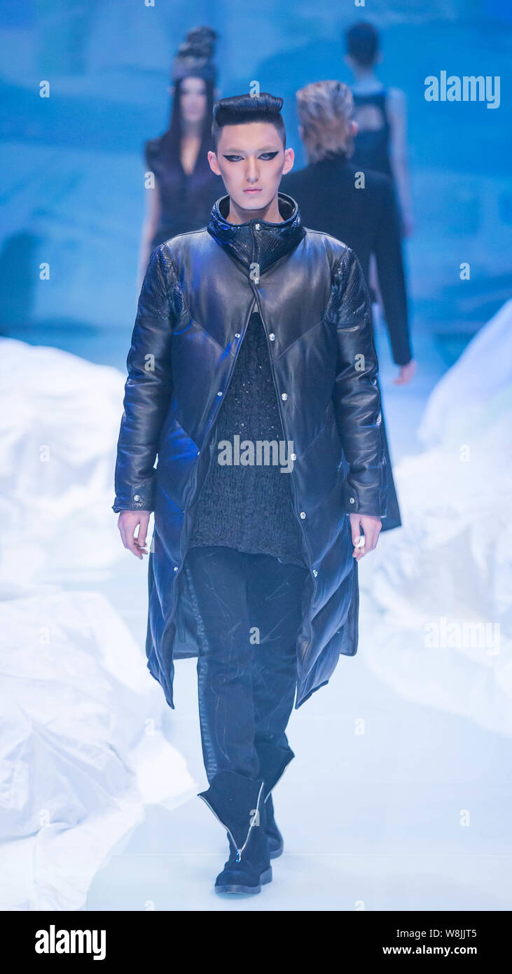 A model displays a new creation designed by Liu Shixi at the "The ...