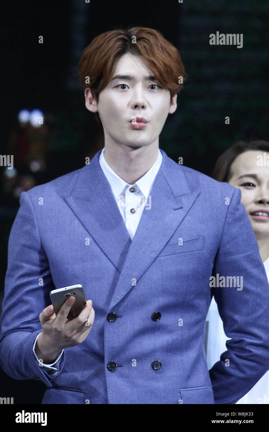 South Korean actor Lee Jong-suk makes faces during a promotional event ...