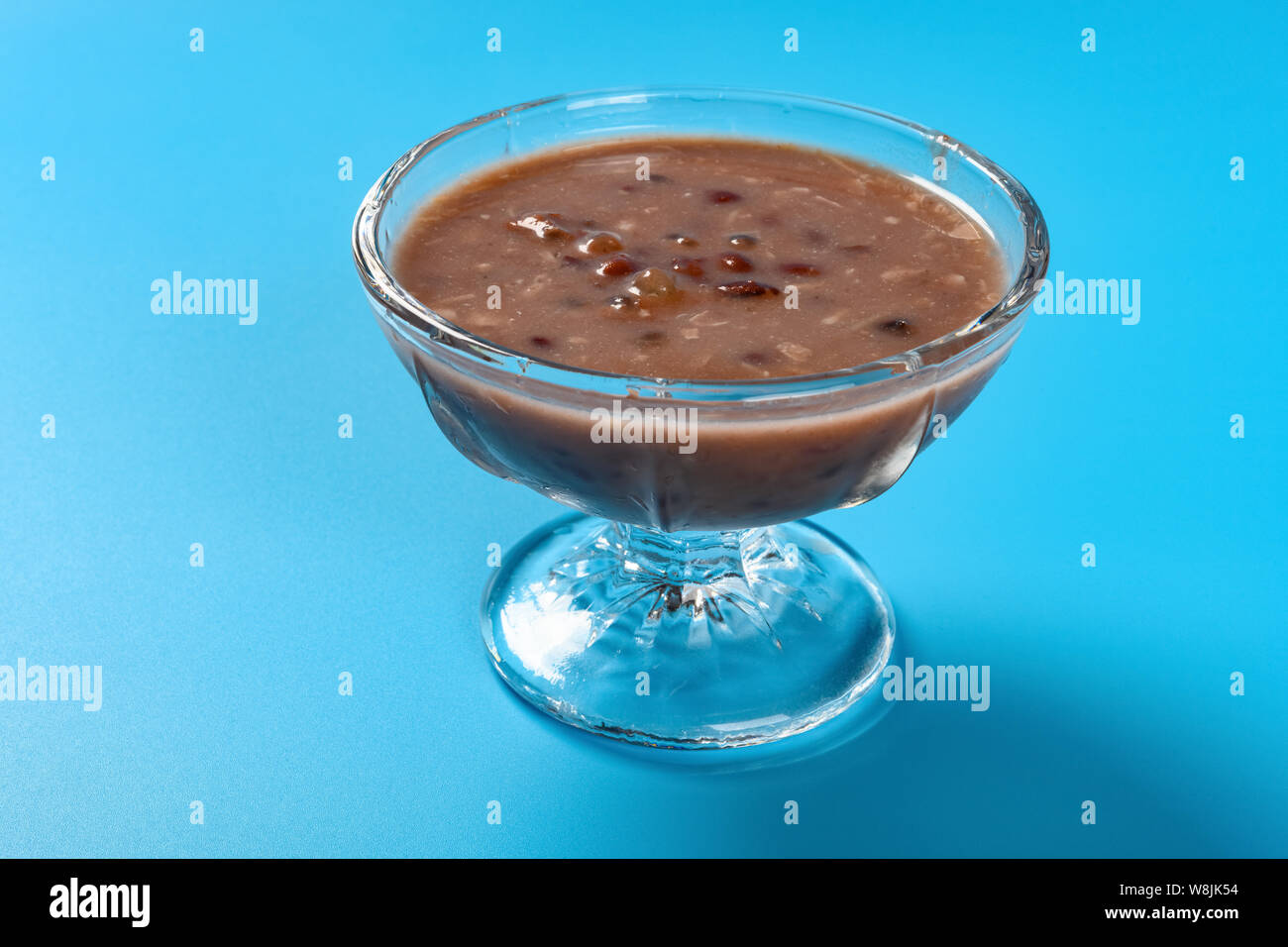 side view Chinese syrup of red bean and sago with shredded coconut in a ...